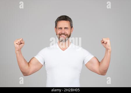 I am strong. Strong man grey background. Fit guy show strength. Muscle ...