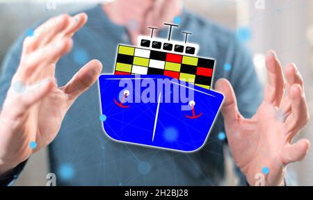 Maritime transportation concept between hands of a woman in background ...