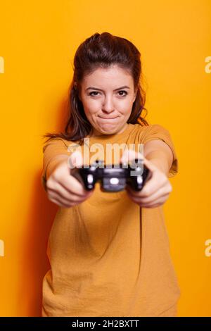 woman gamer with joystick isolated on white background Stock Photo - Alamy