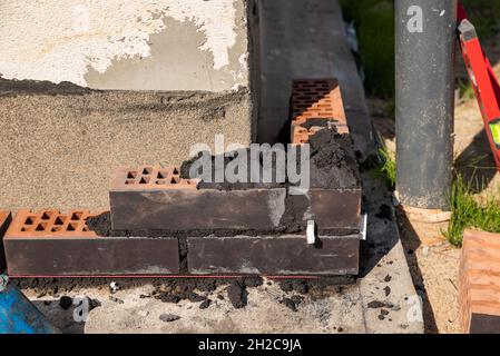 brick plinth around the house Stock Photo - Alamy