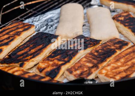 Process of cooking doner kebab on grill at street food festival Stock ...