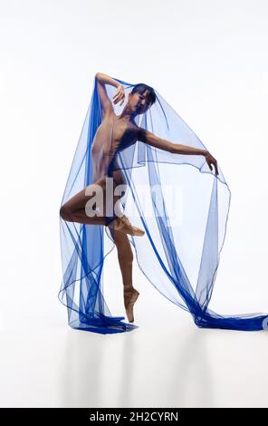 Portrait of young adorable Japanese ballerina dancing with transparent ...