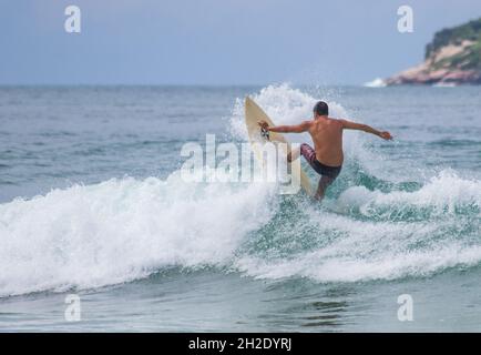 FLORIANOPOLIS, BRAZIL - Apr 01, 2019: A beautiful shot of a man surfing ...