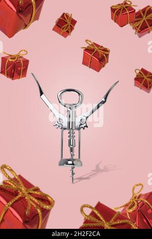Composition with bottle of wine, gift boxes, corkscrew and cookies on ...