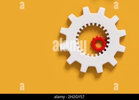 White connecting gear cog inside big cog isolated on yellow background ...