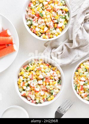 Russian style imitation crab salad with crab sticks, corn, eggs ...