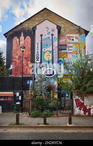 house covered in shop signs hackney Stock Photo - Alamy