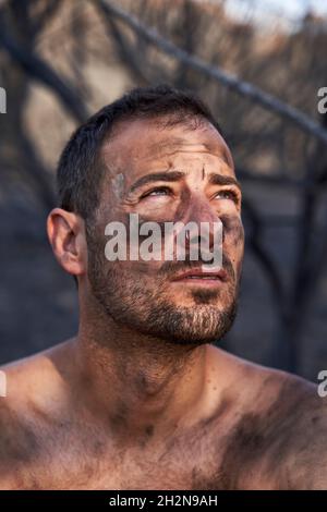 Man with ash and dirt on face Stock Photo - Alamy