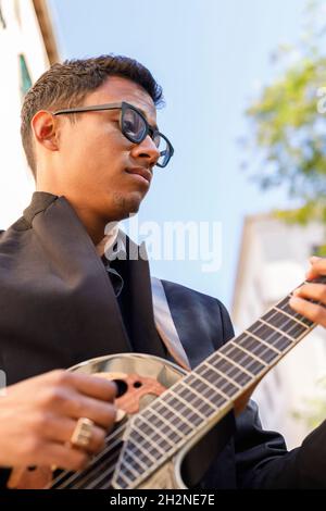 Young hispanic artist man making selfie by the smartphone drawing at ...