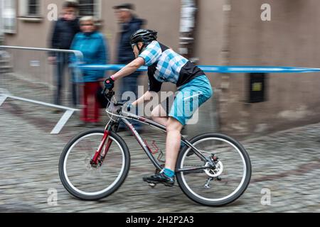 Lublin, Poland - May 24, 2015: Bike city street race Eliminator MTB - competitor riding through ...
