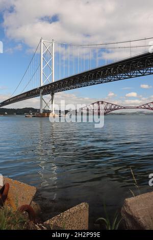 Two railway bridges with train at night, landscape, traces of light ...