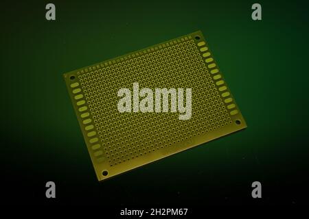 empty clear universal prototype printed circuit board on the background ...