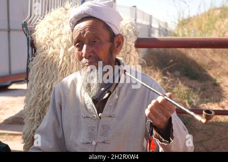 Elder Chinese man with turban at Jingbian, China Stock Photo - Alamy
