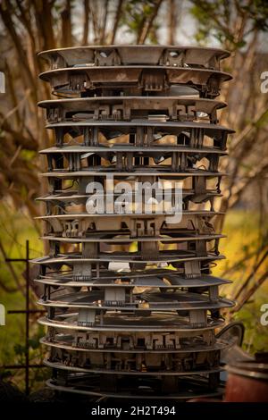 Pile of old steal rims thrown away into nature Stock Photo - Alamy