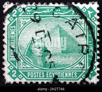 EGYPT - CIRCA 1888: a stamp printed in Egypt shows Sphinx and pyramids ...
