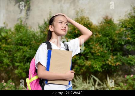 Girl Student Memory Problems With Books Stock Photo - Alamy