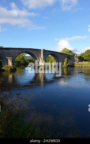 Medieval stone arches of Old Stirling Bridge over the River Forth with ...