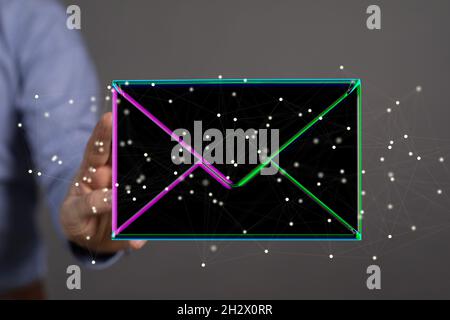 A male's hand pointing to illustrated email inbox electronic ...