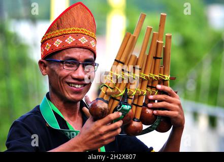 Dusun ethnic men from the interior of Kiulu, Sabah, Malaysia, show a ...