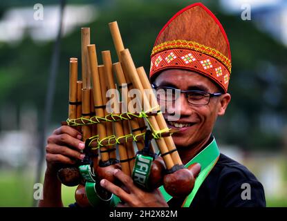 Dusun ethnic men from the interior of Kiulu, Sabah, Malaysia, show a ...