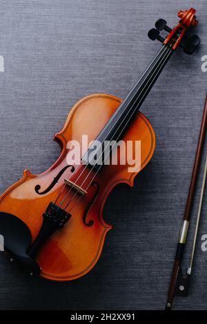 Classical violin on grey background Stock Photo - Alamy