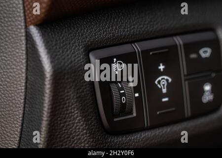 Headlights corrector adjustment buttons. Сlose up view of the modern ...