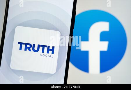 Truth Social app logo seen on the smartphone with blurred Facebook logo ...