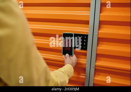 A warehouse worker testing the digital management system Stock Photo ...