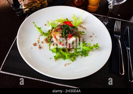 Cod timbale with baked red pepper, rocket and olive tapenade Stock ...