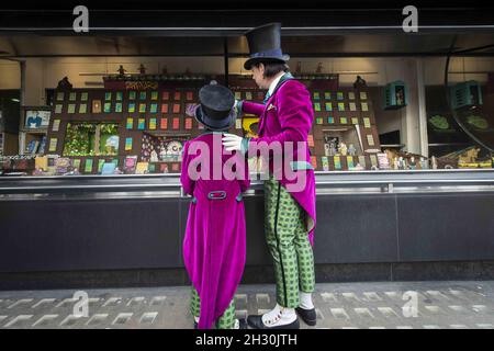 Willy Wonka (Ross Dawes) and Charlie (Troy Tipple) stand for a ...