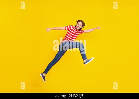 Photo of pretty funky guy dressed striped shirt having fun pointing ...