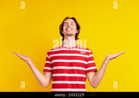 Photo of dreamy funny man wear turquoise clothes talking modern device ...
