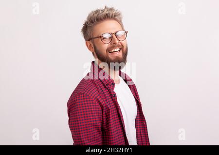 Portrait of good mood optimistic guy brunet hairdo green hoodie palm ...