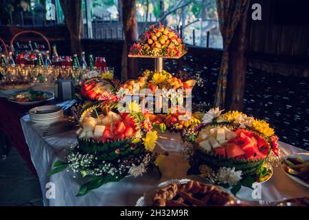 Fruit table with Canape appetizer: carved watermelons filled with ...