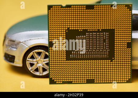 CPU chip and semiconductors with car toy. Global car chip shortage ...