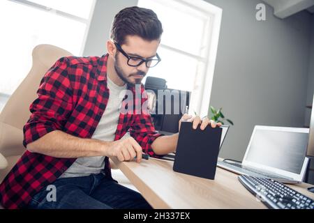 Portrait of attractive skilled guy tech leader partner working remotely ...