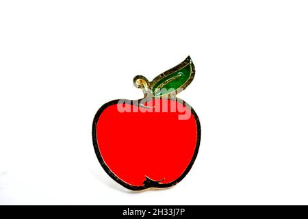 Red apple pin badge on white background Stock Photo - Alamy