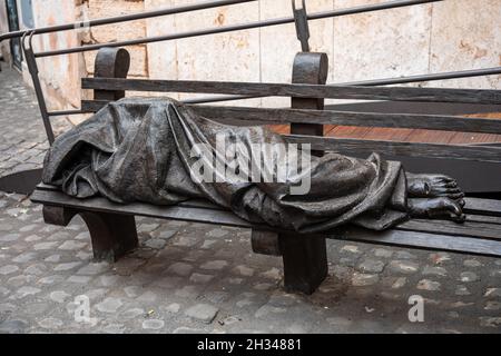 Homeless Jesus sculpture bronze on a bench outside Christ Church ...