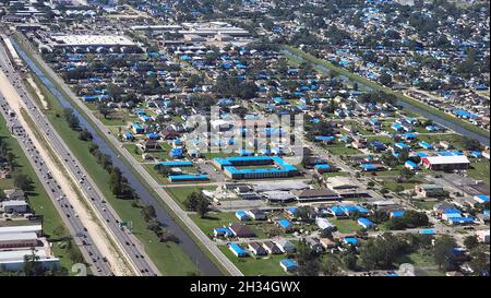 Aerial view of blue FEMA tarps on houses in the wake of Hurricane ...