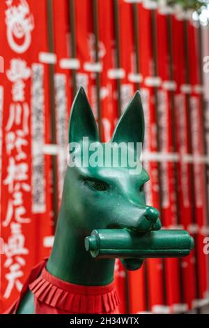 Statue of Kitsune (fox) part of Japanese folklore, in front of Saidaiji ...