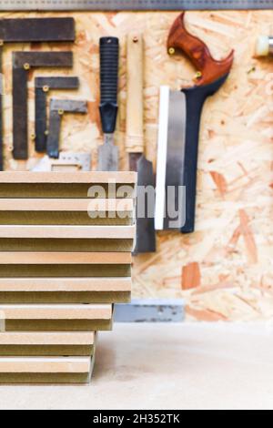 Carpenters workshop interior with wooden planks and work tools of the ...