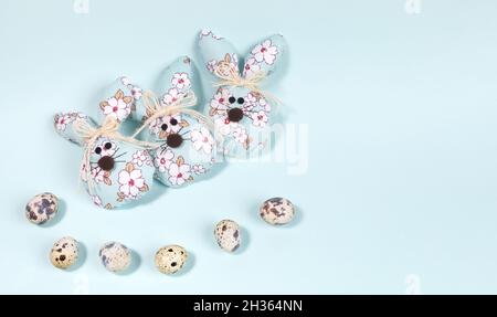 Flat lay Easter symbols arrangement. White eggs on plate with spring ...