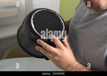 the non-stick coating of the pan is damaged Stock Photo - Alamy