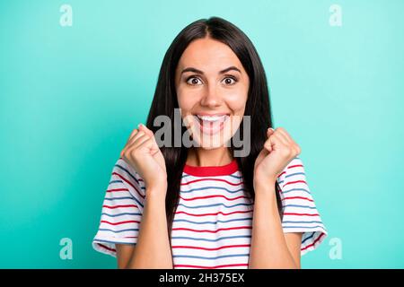 Photo of pretty lucky lady wear striped t-shirt rising bank card fist ...