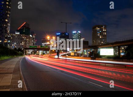 Traffic light trails on Aspen Way, Canary Wharf London England UK Stock ...