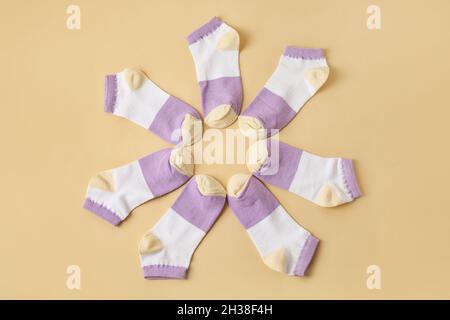 Frame made of socks on color background Stock Photo - Alamy