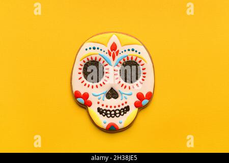 Skull shaped cookie on color wooden background, closeup. El Dia de ...