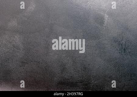 black plastic surface with multiple fingerprints, macro photo Stock ...