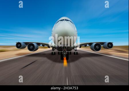 big passenger airplane is landing to runway of airport Stock Photo - Alamy