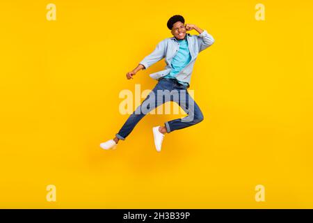 Photo of funky strong dark skin man wear sweatshirt smiling jumping ...